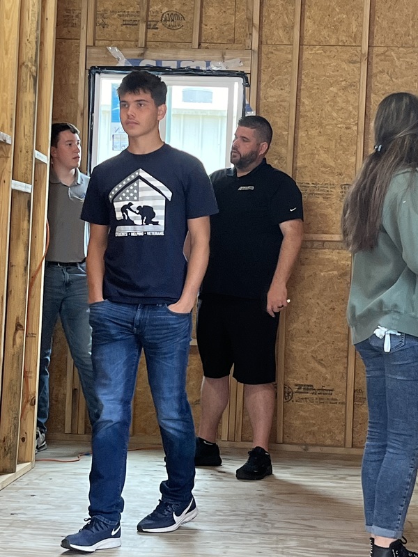 KHS Tiny Homes Project signs "Notes of Love" | Kingwood High School